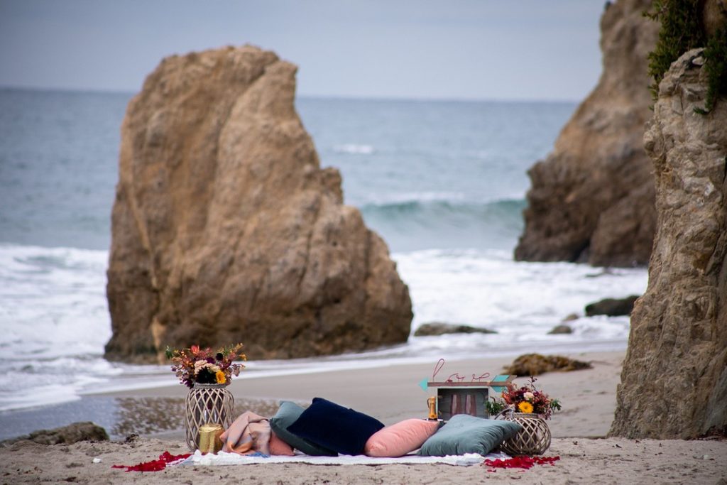 Cliffside fall El Matador Beach proposal with romantic picnic