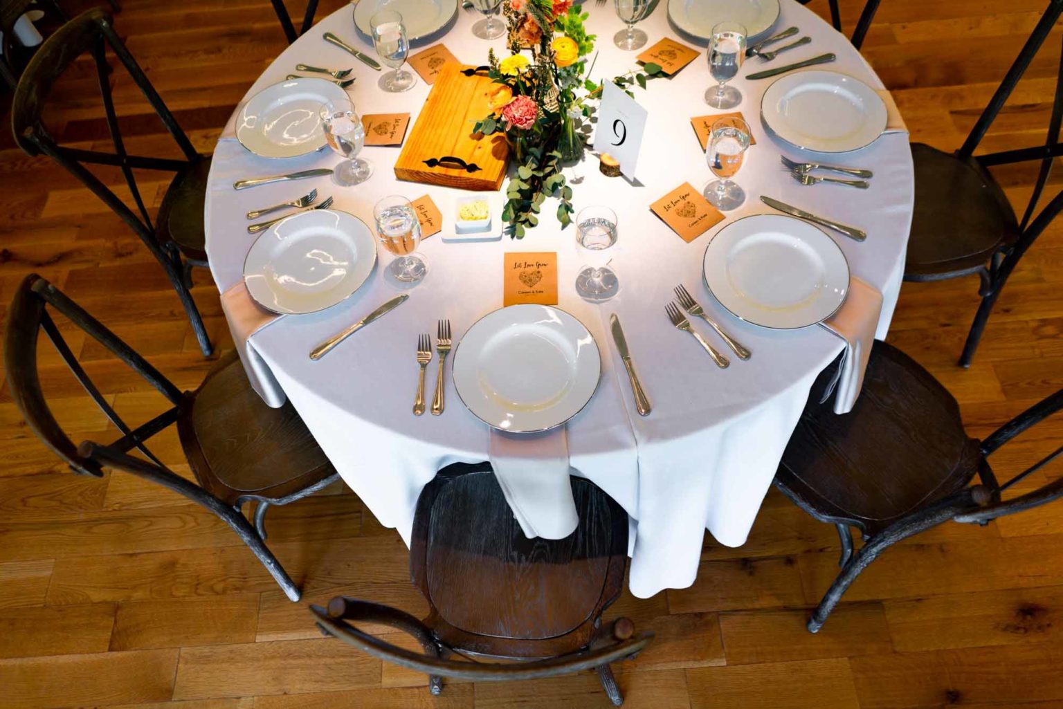 Outdoor Colorado wedding at historic cottage with triangle arch